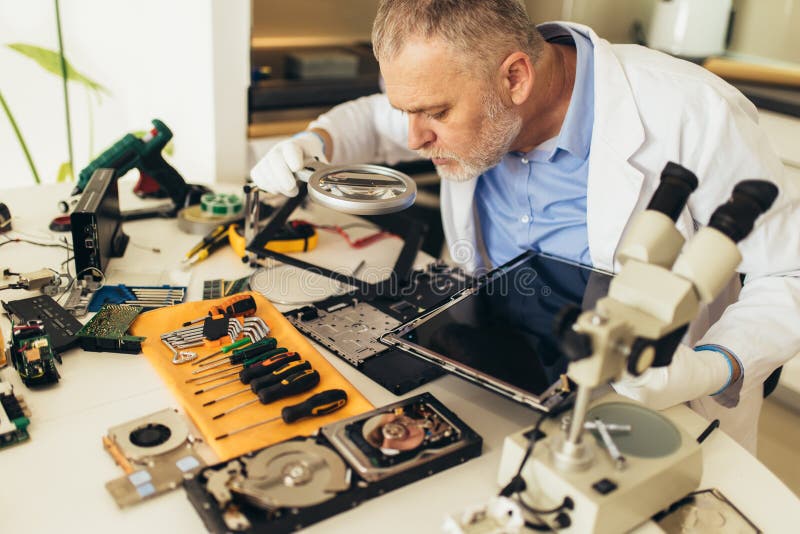 Engineer Fixing Broken Computer Equipment. Stock Photo - Image of ...
