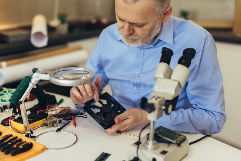 Engineer Fixing Broken Computer Equipment. Stock Image - Image of ...