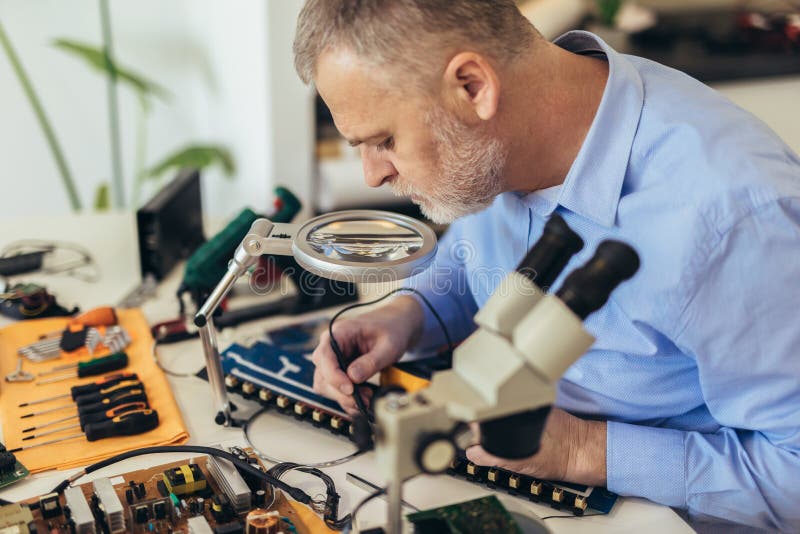 Engineer Fixing Broken Computer Equipment. Stock Image - Image of ...