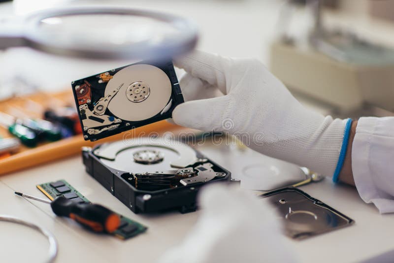 Engineer Fixing Broken Computer Hard Disc. Electronic Repair Shop ...