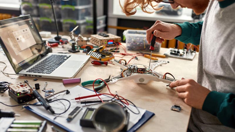 It Engineer Fixing Broken Drone with Screwdriver Stock Photo - Image of ...