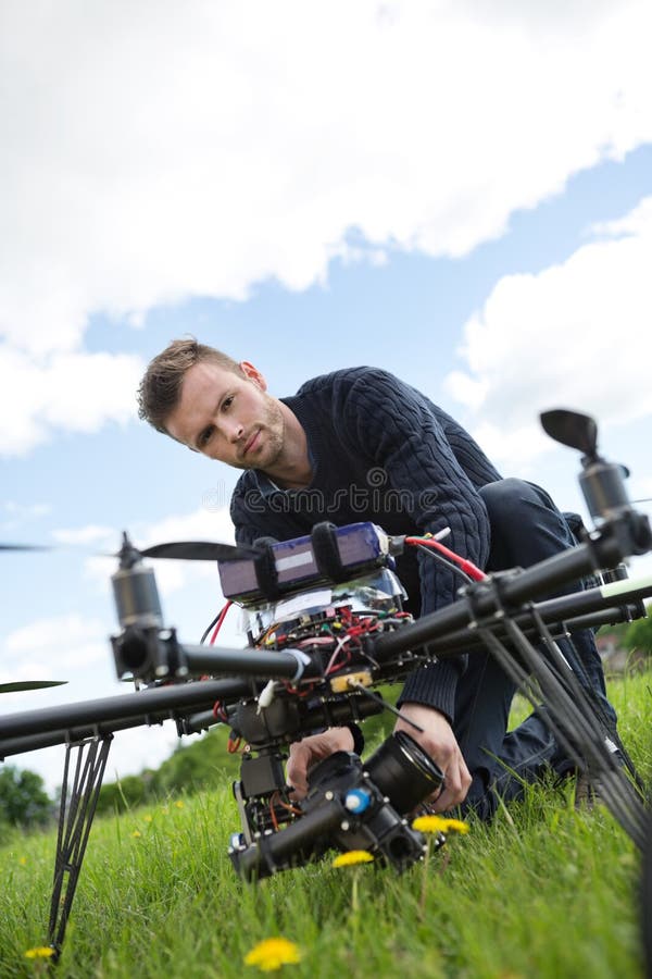 Engineer Fixing Camera on UAV Helicopter Stock Photo - Image of person ...
