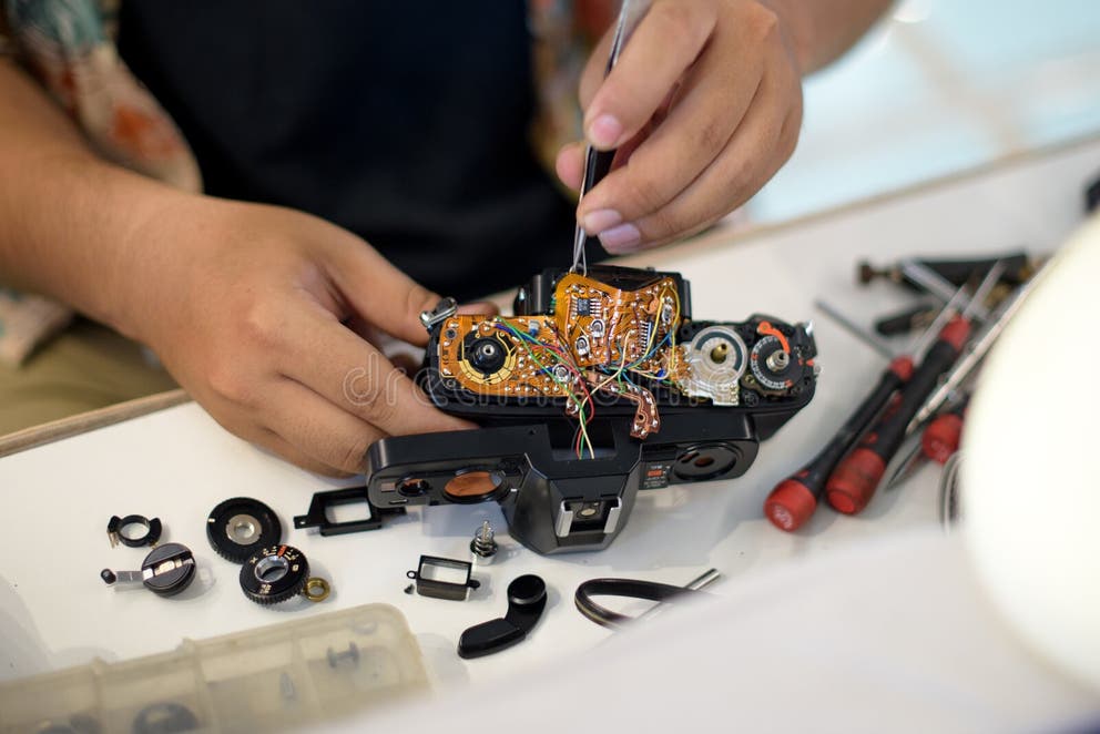 Engineer Fixing a Film Camera with Tools Stock Photo - Image of object ...