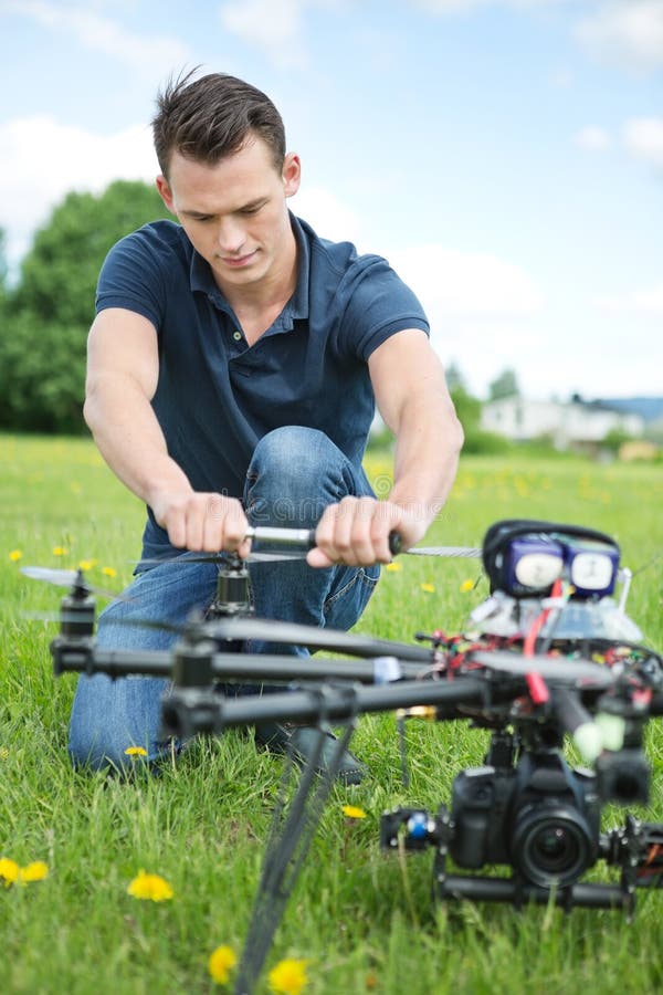 Technician Flying UAV Octocopter in Park Stock Photo - Image of ...