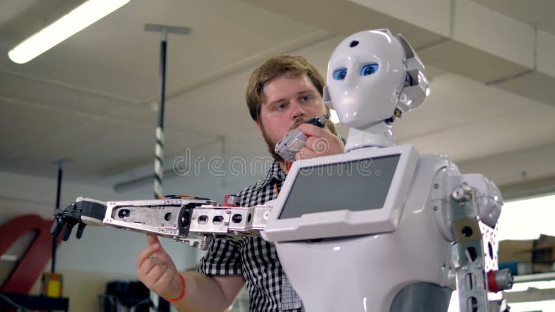 Engineer Fixing Robot`s Head with a Tool. Stock Video - Video of hand ...