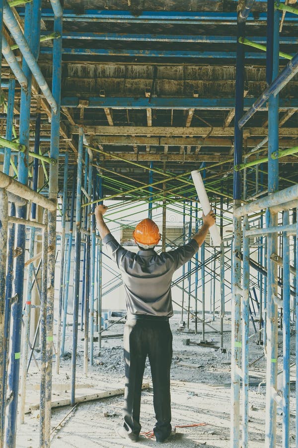 Engineer or Foreman with Blueprint in Building Construction Site. Stock ...