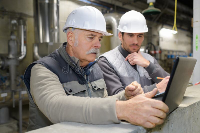 Foreman in a Factory Explains Something Stock Image - Image of ...