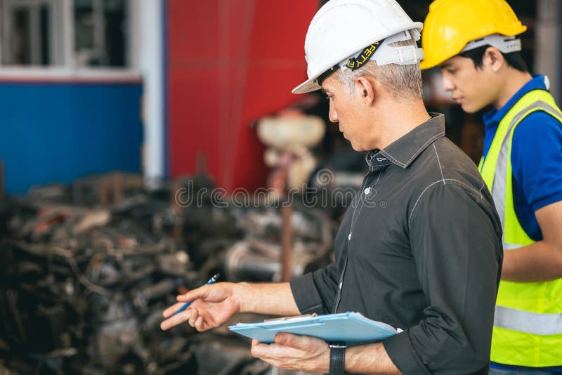 Engineer Foreman Manager Working Check Stock with Young Male Staff ...