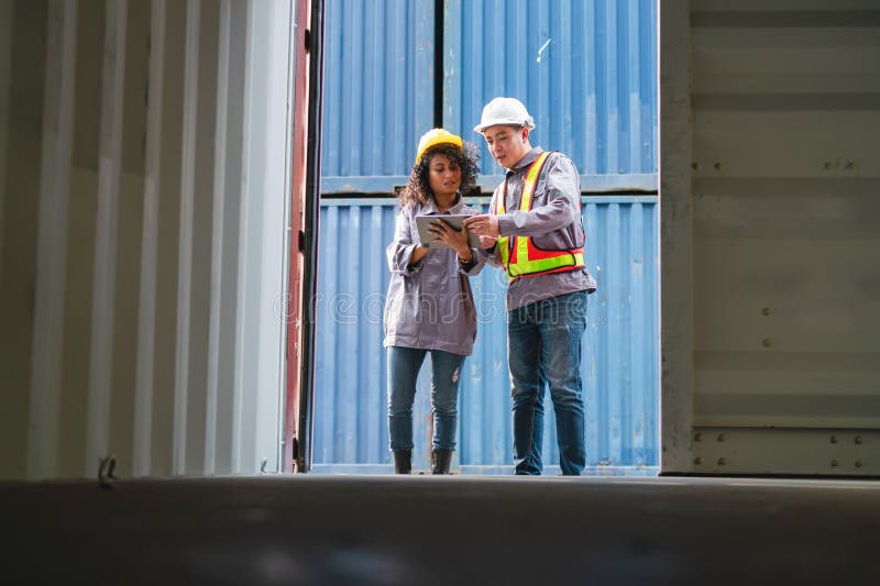 Engineer and Foreman Team in Safety Gear Inspecting Containers Box at ...