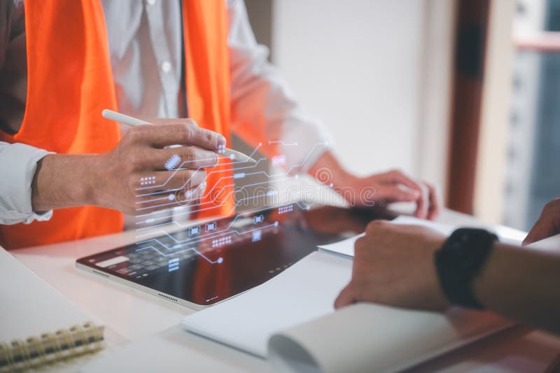 Engineer or Foreman Using Tablet and Pen Presenting or Discussing ...