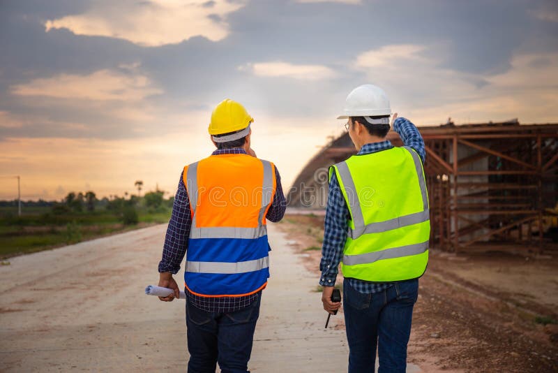 Engineer and Foreman Worker Checking Project at Building Site, Engineer ...