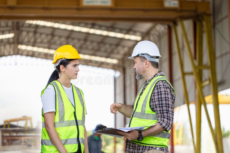 Engineer and Foreman Worker Checking Project at Building Site, Engineer ...
