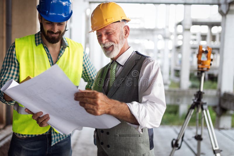Engineer, Foreman and Worker Discussing in Building Construction Site ...