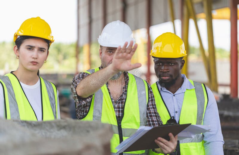Engineer and Foreman Worker Team with Blueprints Checking Project at ...