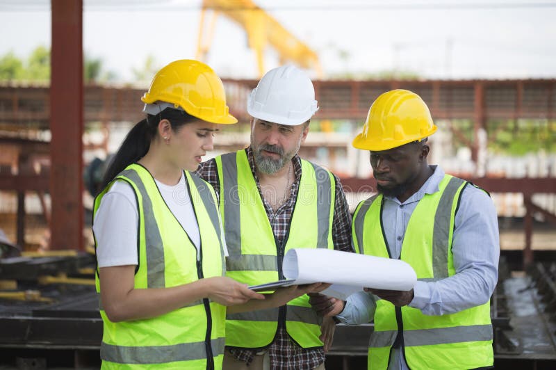 Engineer and Foreman Worker Team with Blueprints Checking Project at ...