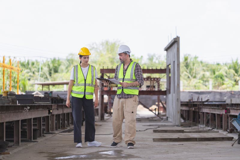 Engineer and Foreman Worker Team with Blueprints Checking Project at ...