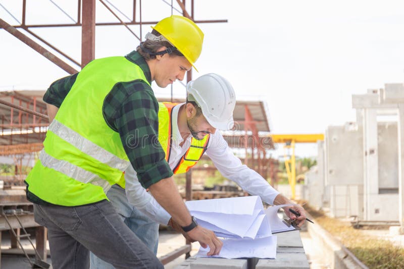 Engineer and Foreman Worker Team with Blueprints Checking Project at ...