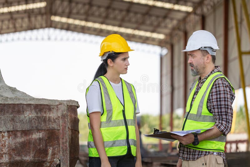 Senior Engineer and Female Foreman Team Checking Project at Precast ...