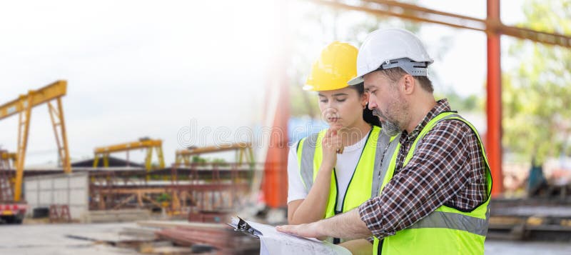 Engineer and Foreman Worker Team with Blueprints Checking Project at ...