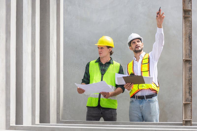 Engineer and Foreman Worker Team Checking Project at Precast Concrete ...