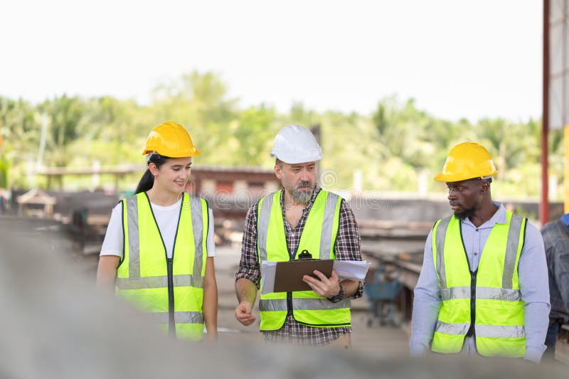 Senior Engineer and Female Foreman Team Checking Project at Precast ...