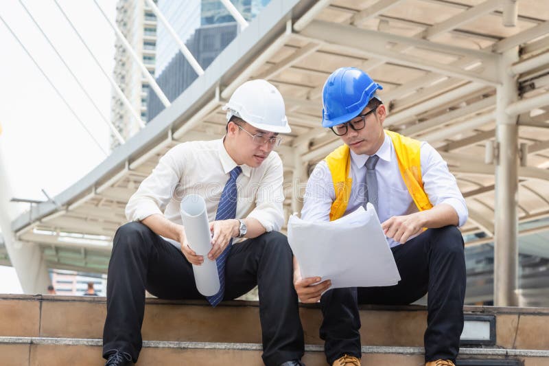 Engineer and Foreman Worker Team with Drawing Paper Planning Projects ...