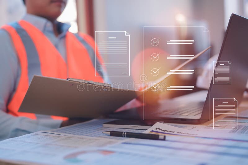 An Engineer or Foreman Working on Site Holding Paper Clipboard and ...
