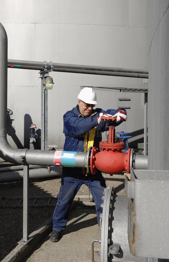 Oil storage and engineer stock photo. Image of distillery - 3439770