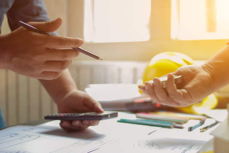 The Engineer is Giving Advice and Consulting with the Designer To Find ...