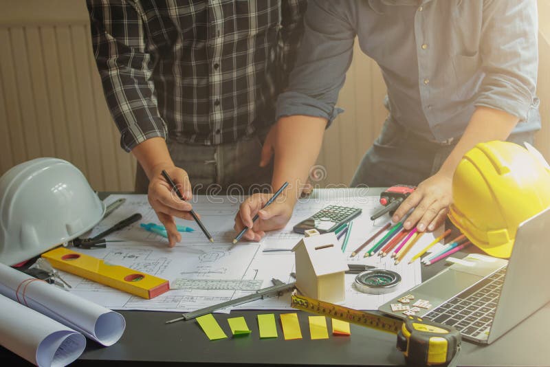 The Engineer is Giving Advice and Consulting with the Designer To Find ...