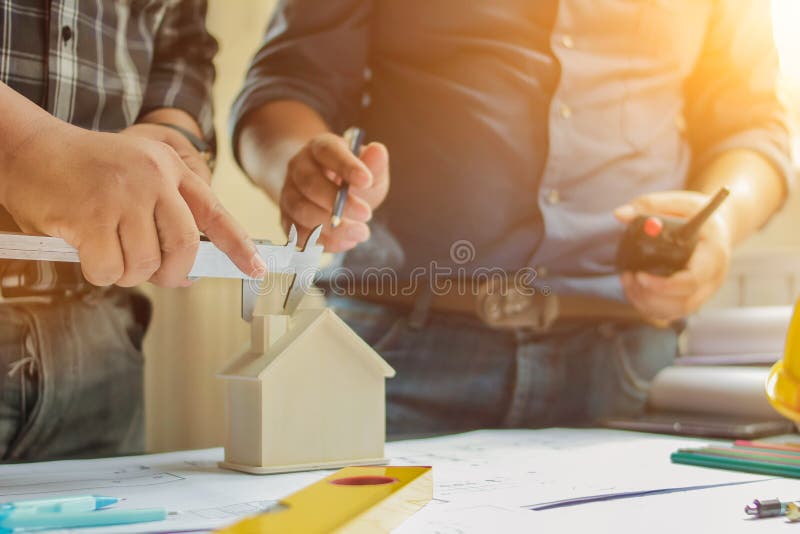 The Engineer is Giving Advice and Consulting with the Designer To Find ...