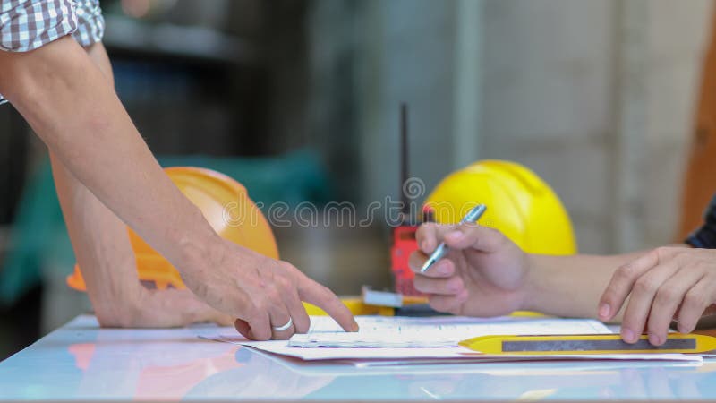 The Engineer is Giving Advice and Consulting with the Designer To Find ...