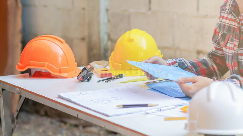 The Engineer is Giving Advice and Consulting with the Designer To Find ...