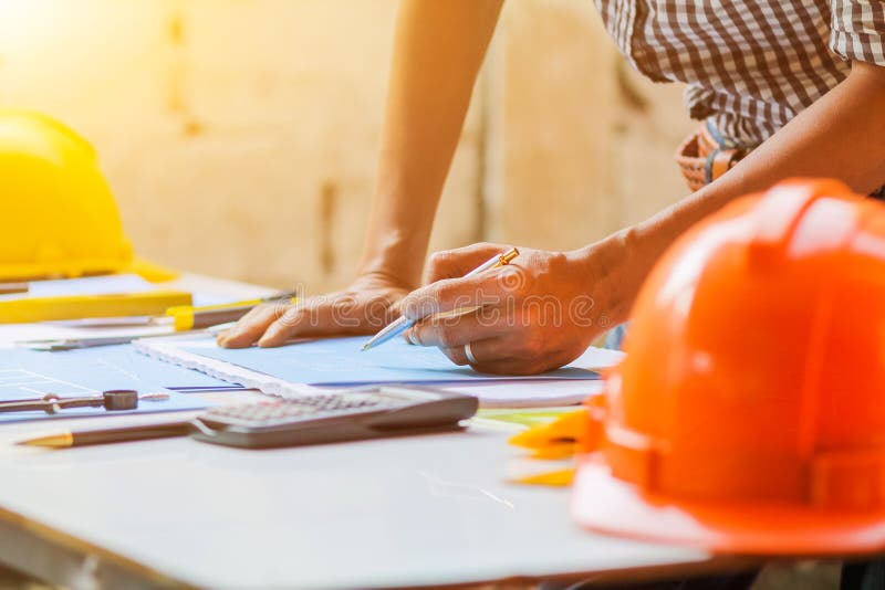 The Engineer is Giving Advice and Consulting with the Designer To Find ...