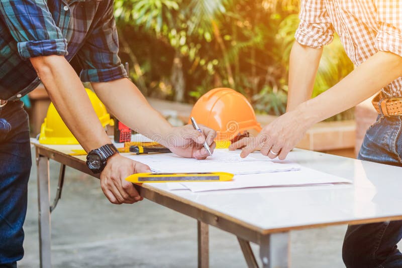 The Engineer is Giving Advice and Consulting with the Designer To Find ...