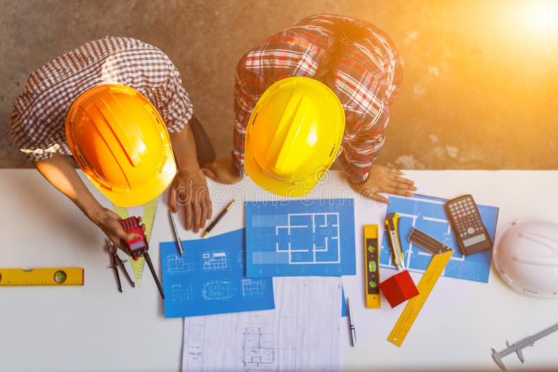 The Engineer is Giving Advice and Consulting with the Designer To Find ...