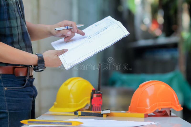 The Engineer is Giving Advice and Consulting with the Designer To Find ...