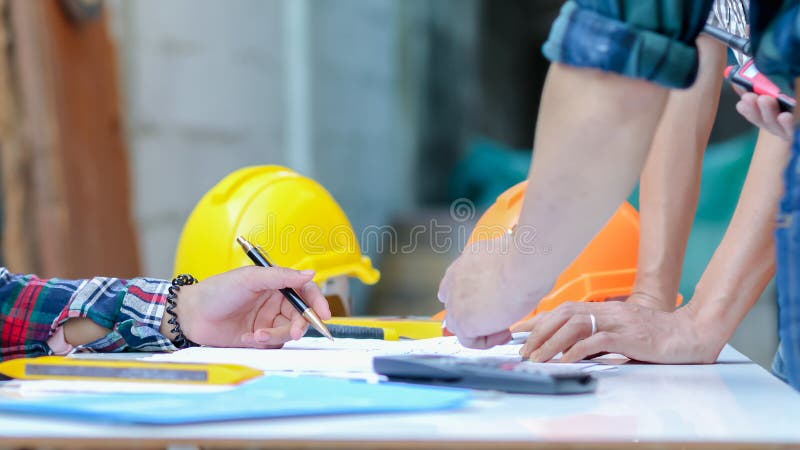 The Engineer is Giving Advice and Consulting with the Designer To Find ...