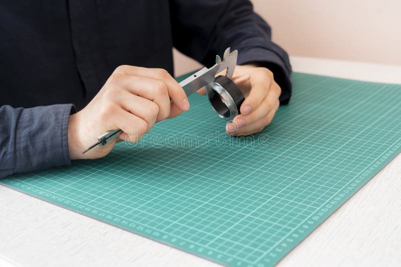 The Engineer Hand Working and Measure the Parts with Caliper Tool Stock ...