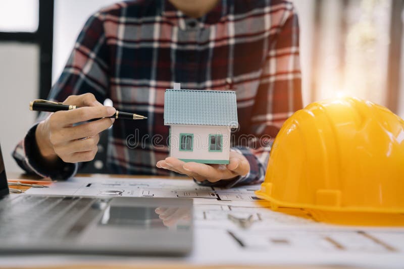 Engineer Hands Making Model House. Engineer Teams Working in the Office ...