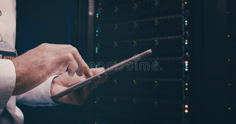 Engineer, Hands or Man with Tablet in Server Room for Security Audit, System Backup and Update ...