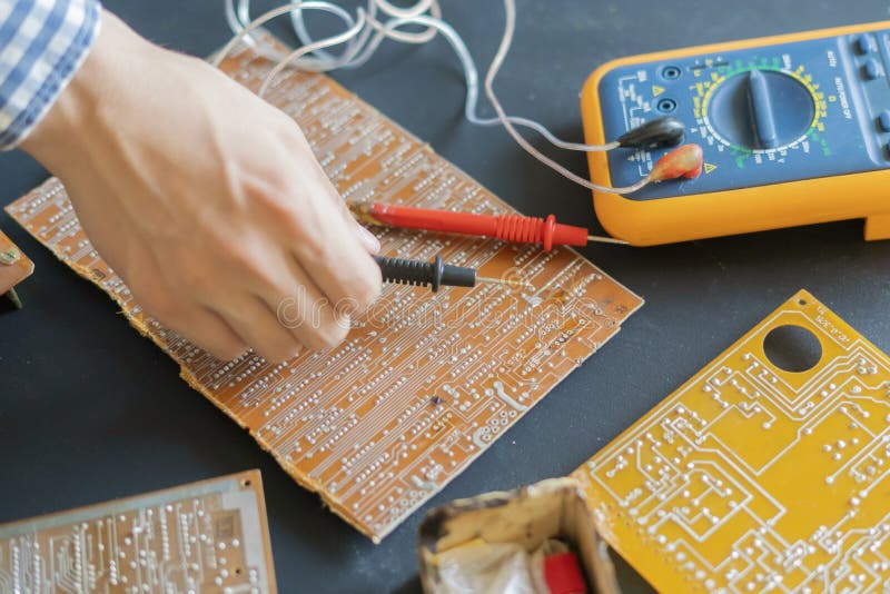 Engineer Hands Measure the Voltage Current on the Electronic Board F ...