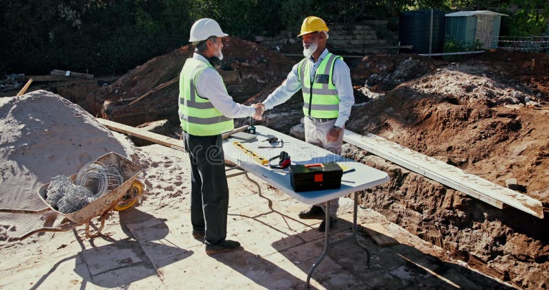 Engineer, Handshake and Architect at Construction Site for ...