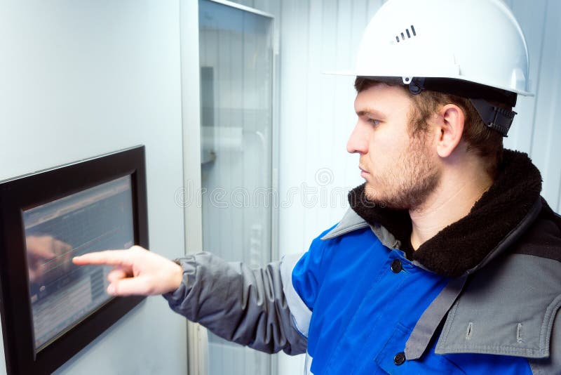 Engineer in Hard Hat Presses His Finger into Touch Screen of Modern ...