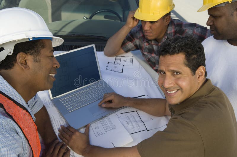 Engineer Having Discussion with Team of Architects Stock Photo - Image ...