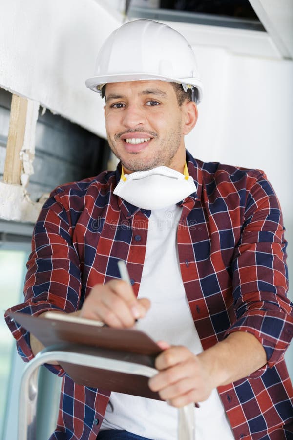 Engineer with Helmet Holds Clipboard Stock Photo - Image of contractor ...