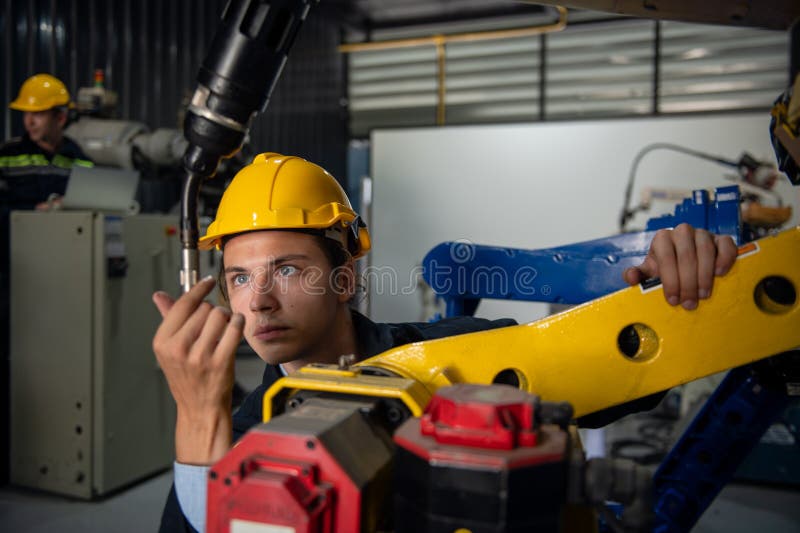 Engineer Inspection Control a Robot Arm Welding Machine with a Remote ...