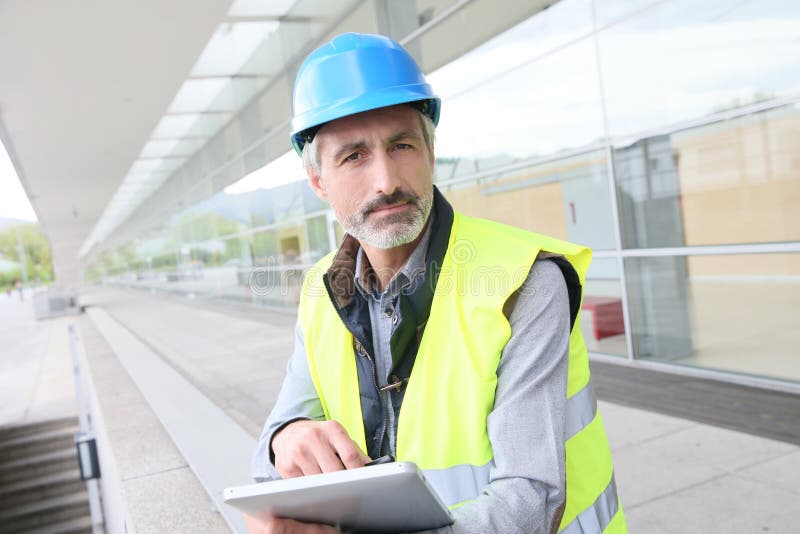 Engineer with Helmet Using Tablet Stock Photo - Image of tablet ...