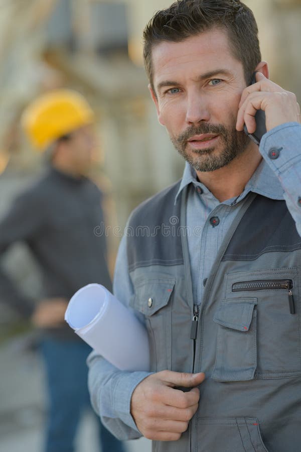 Engineer Holding Blueprint Roll Stock Image - Image of helmet ...