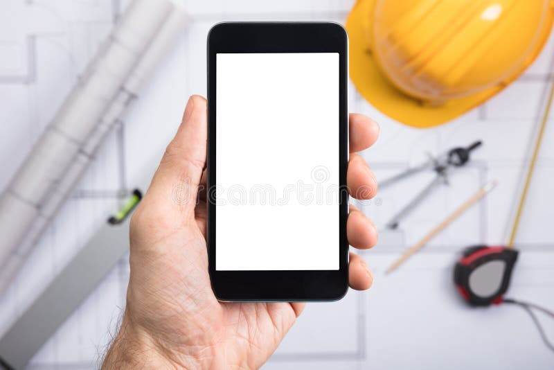 An Engineer Holding Cell Phone Stock Photo - Image of connection ...